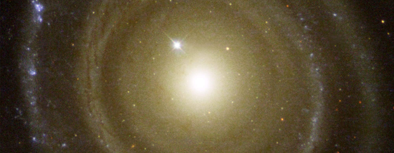 Hubble Reveals "Backwards" Spiral Galaxy | STScI